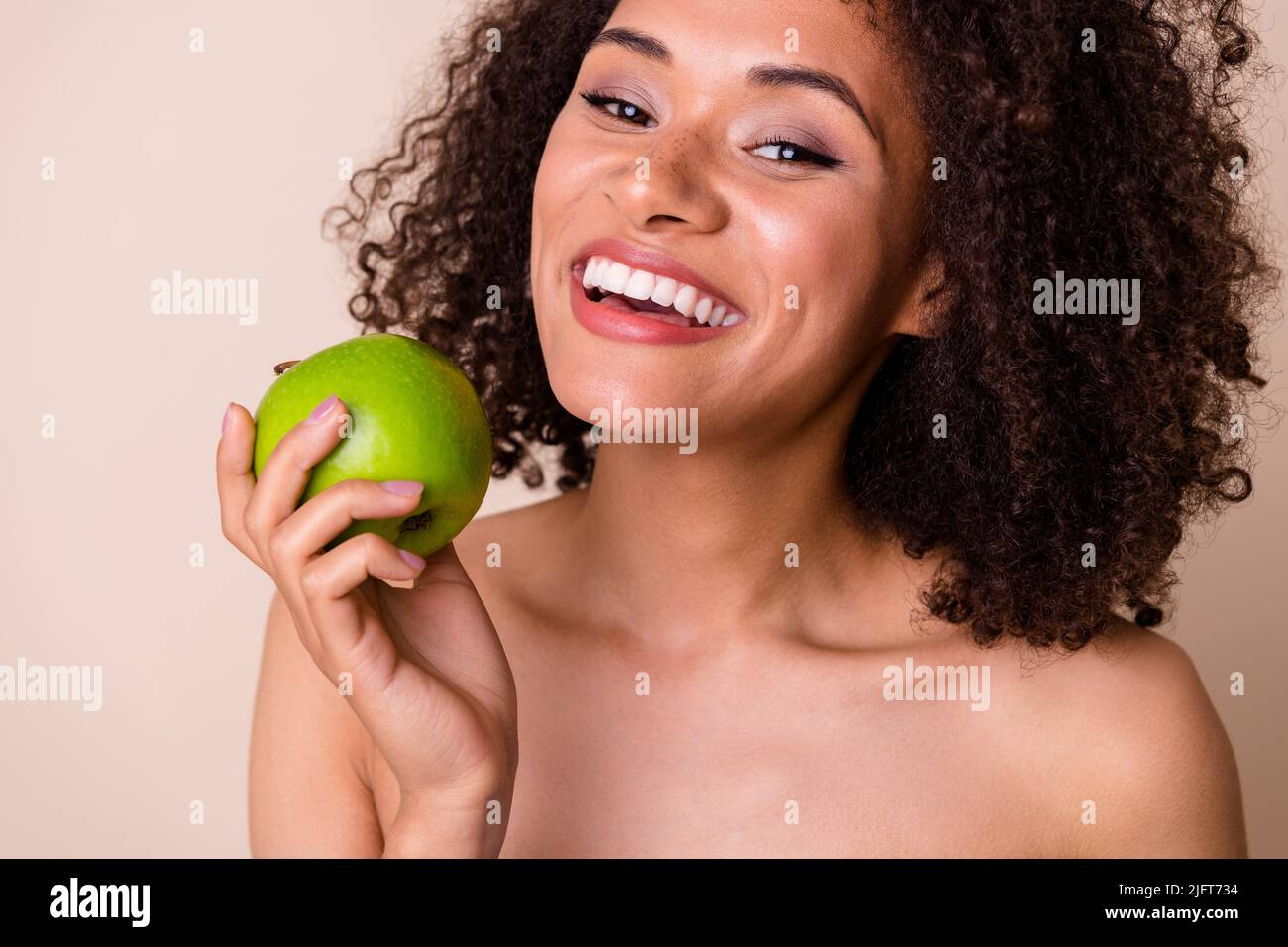 Photo of cheerful sweet lady wear nothing enjoying juicy fruit smiling ...