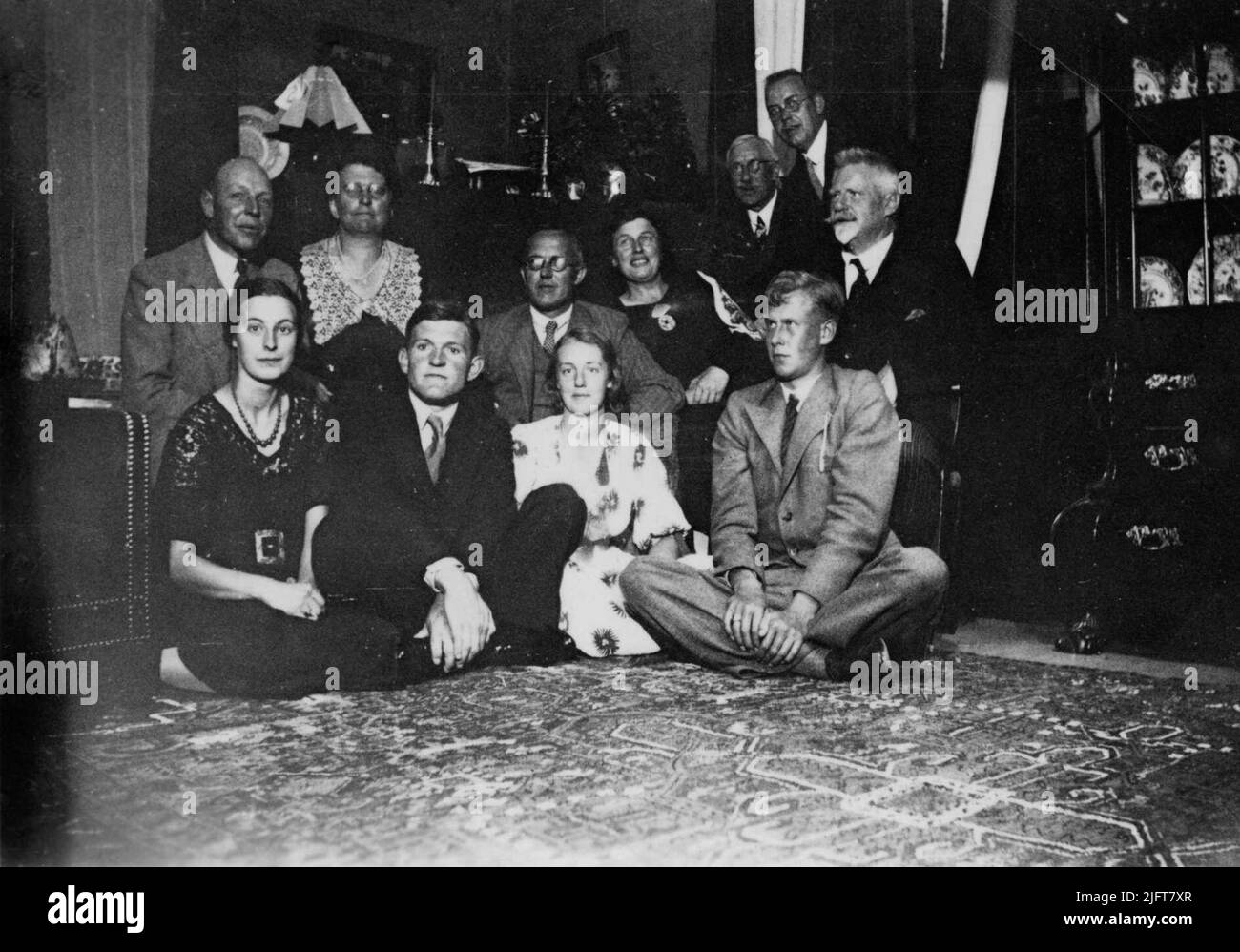 Charles Hammes, sitting second from the left, surrounded by family. On ...