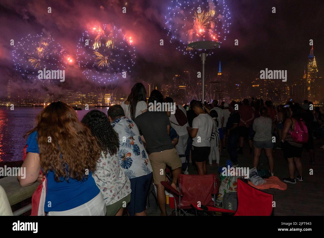 New York, United States. 04th July, 2022. Spectators watch fireworks ...