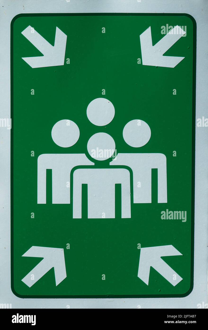 Green an white Assembly point sign. sign is used to gather people and ...