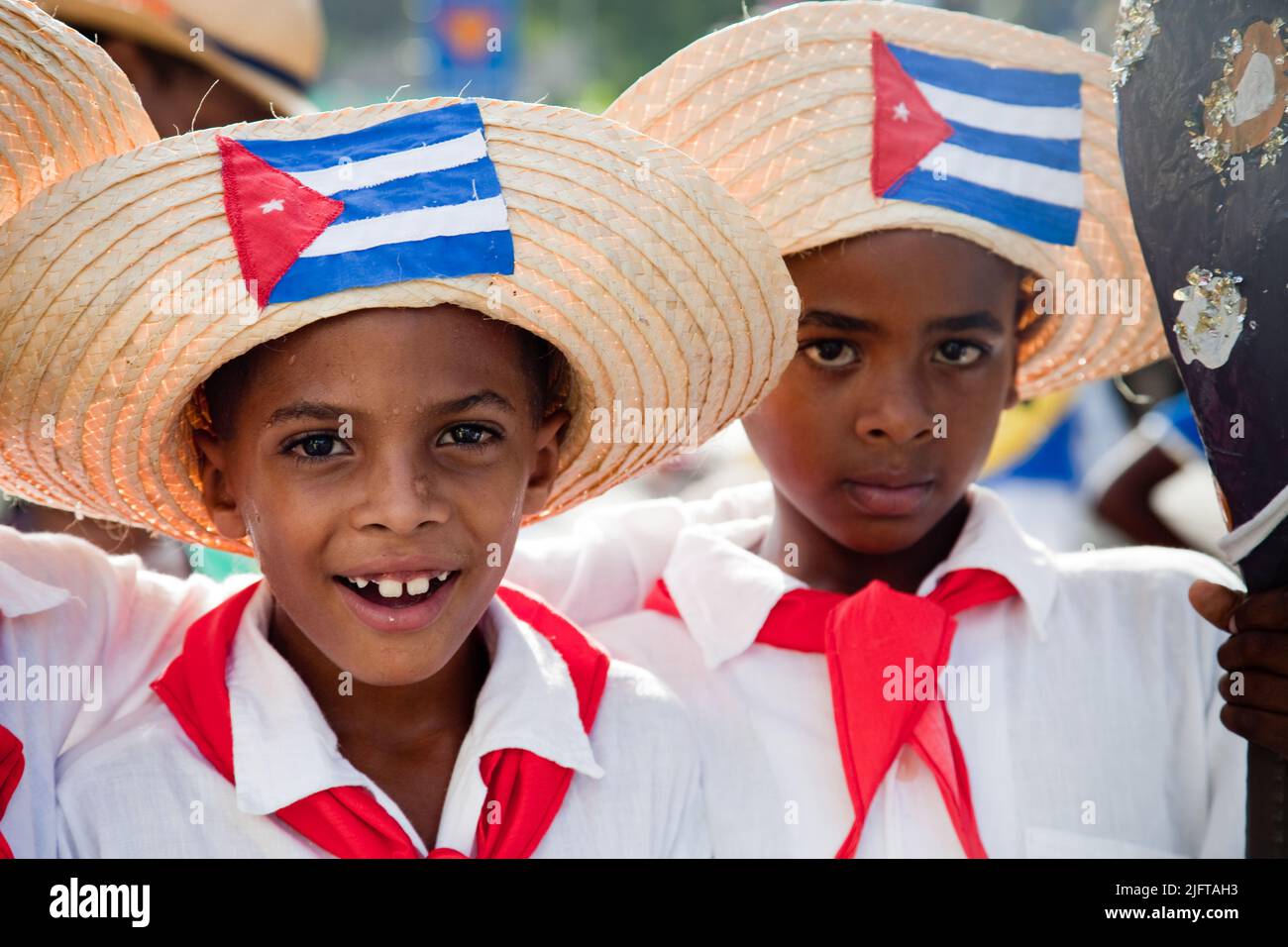 Cuba,Santiago de Cuba.Carnaval in July. Boys wearing straw hat with ...