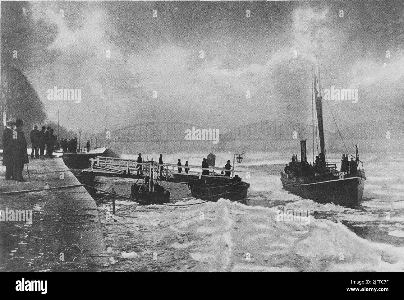 The frozen river De Waal, on the left the jetty of the Gierpont Stock ...