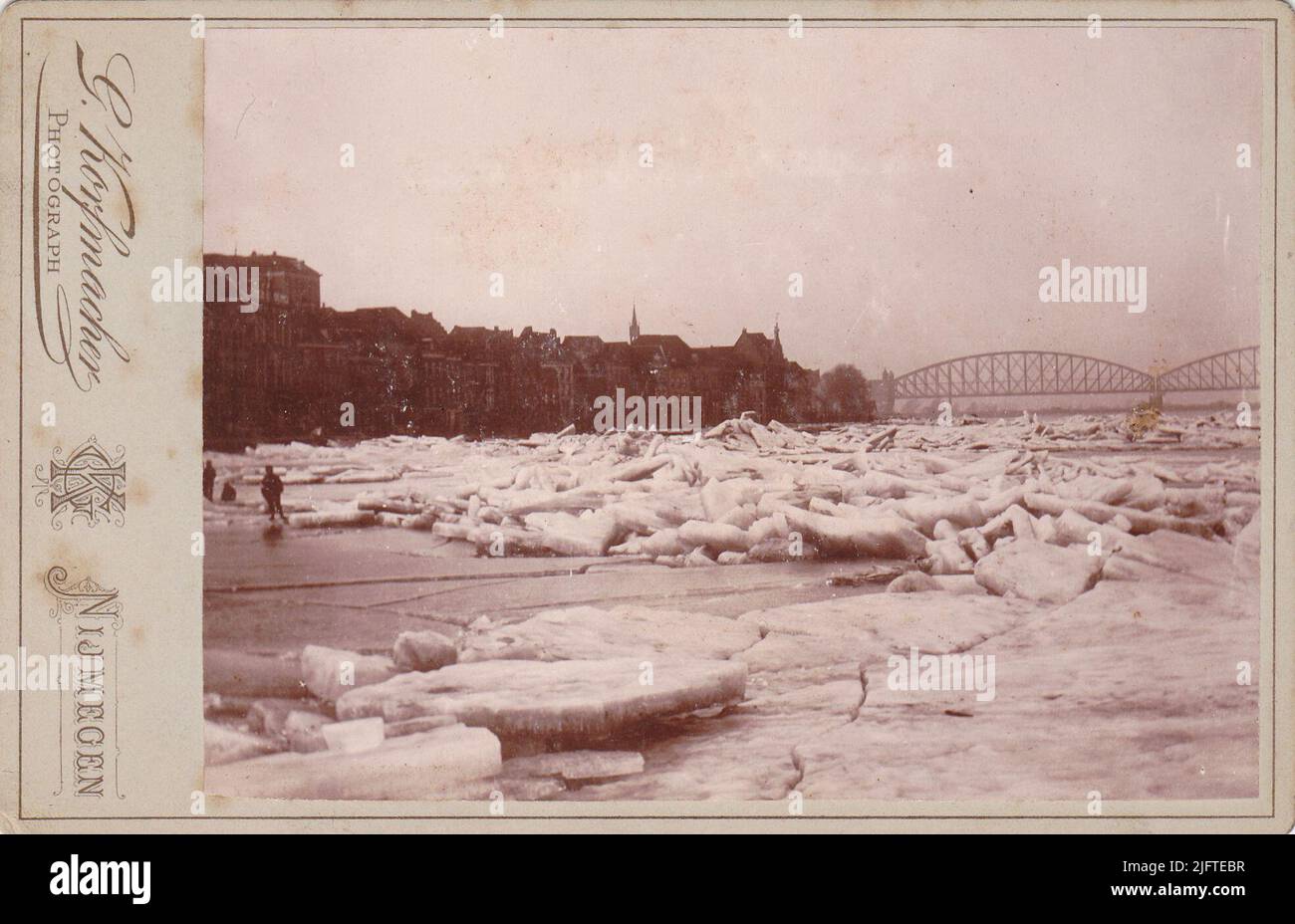 The frozen river Waal, with a view of the Waalkade and the railway ...