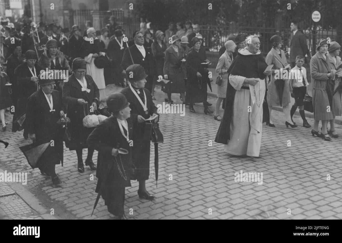 A procession with a Father Dominican in the middle Stock Photo - Alamy