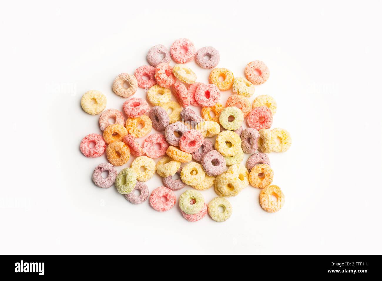 Fruit flavor colored cereals on a white background in a top view Stock ...