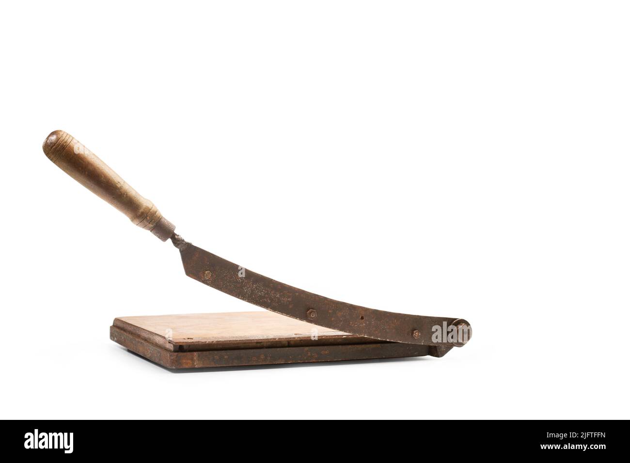 A vintage manual guillotine isolated on a white background Stock Photo ...
