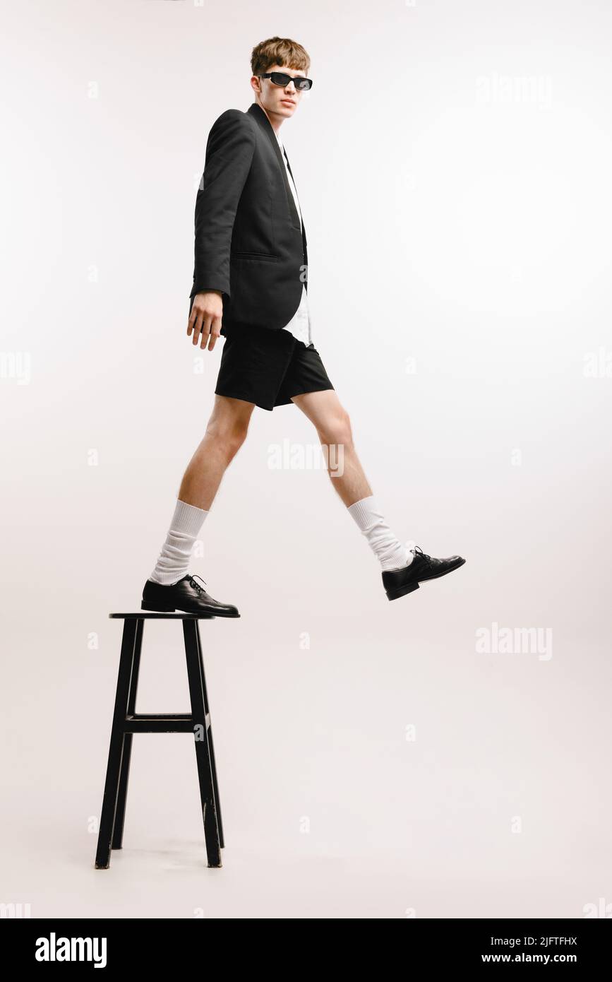 Student standing on chair hi-res stock photography and images - Alamy