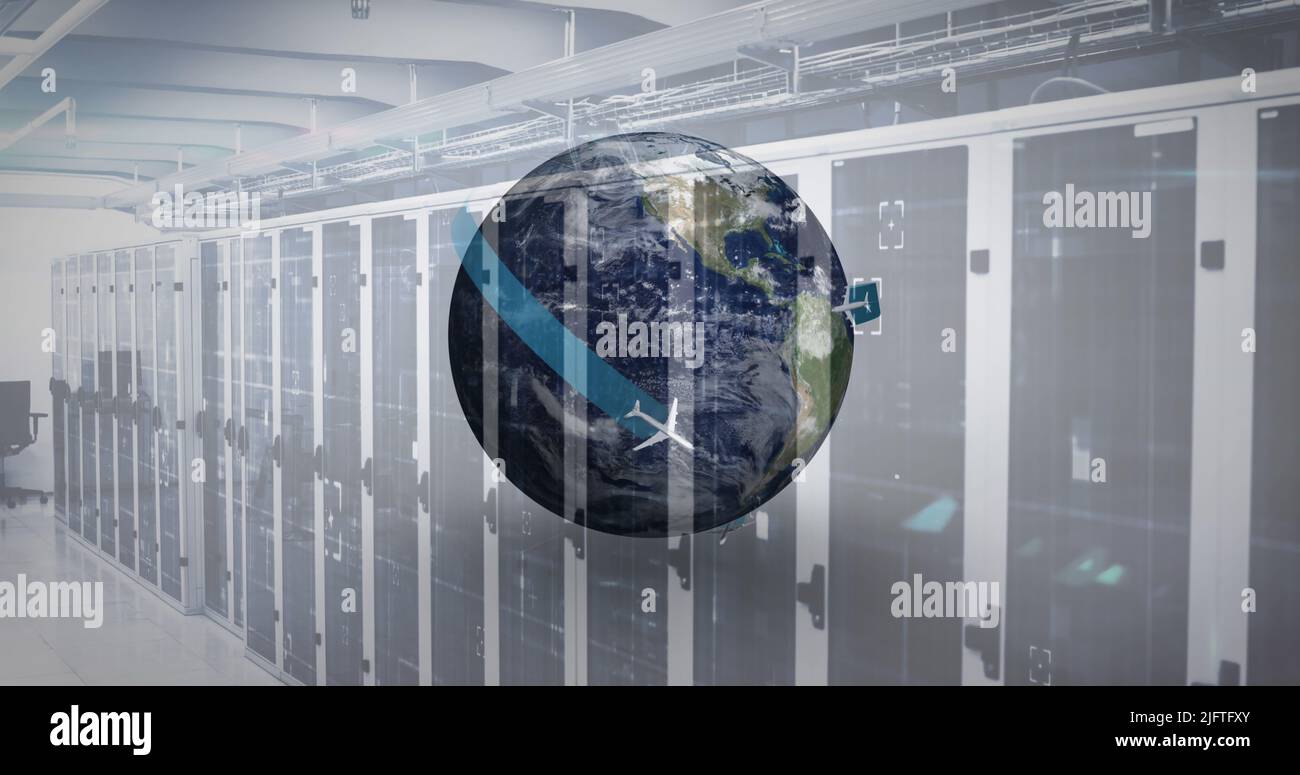 Digital image of airplane icons flying around the globe against empty server room. Global ...