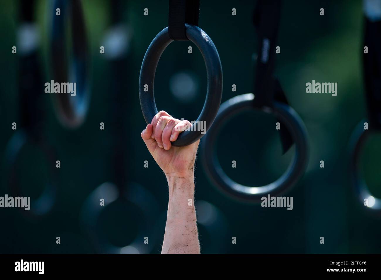 Athlete using gymnastics rings. Horizontal sport theme poster, greeting ...