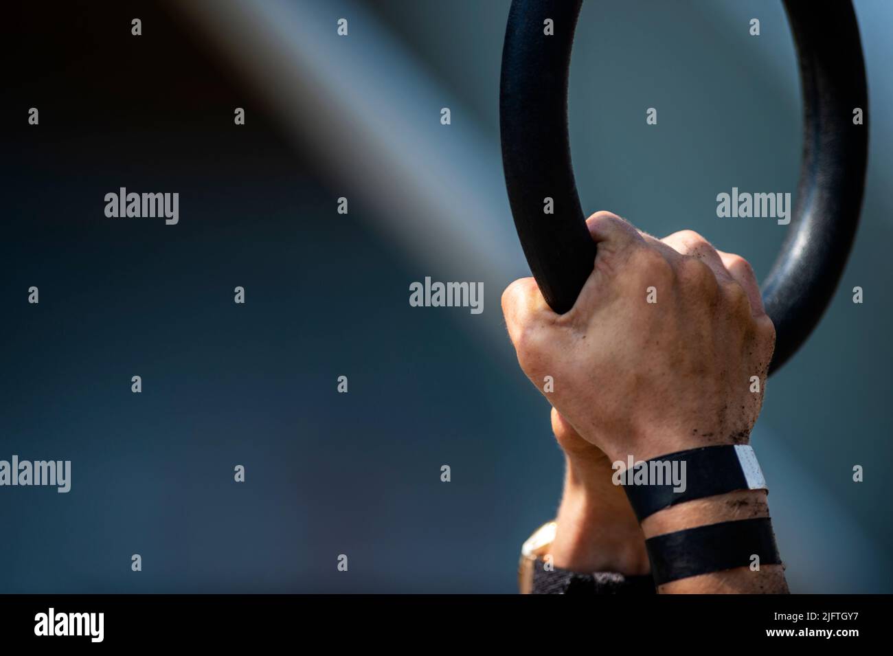 Athlete using gymnastics rings. Horizontal sport theme poster, greeting ...