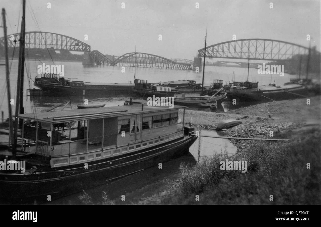 The railway bridge with the middle segment destroyed by its own troops ...