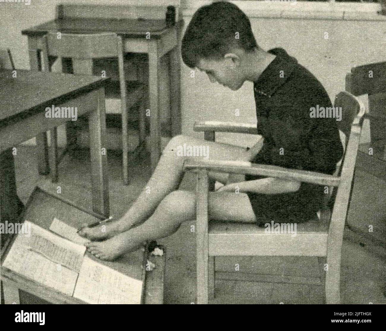 Handicapped children learn to write with their feet on the Sint ...