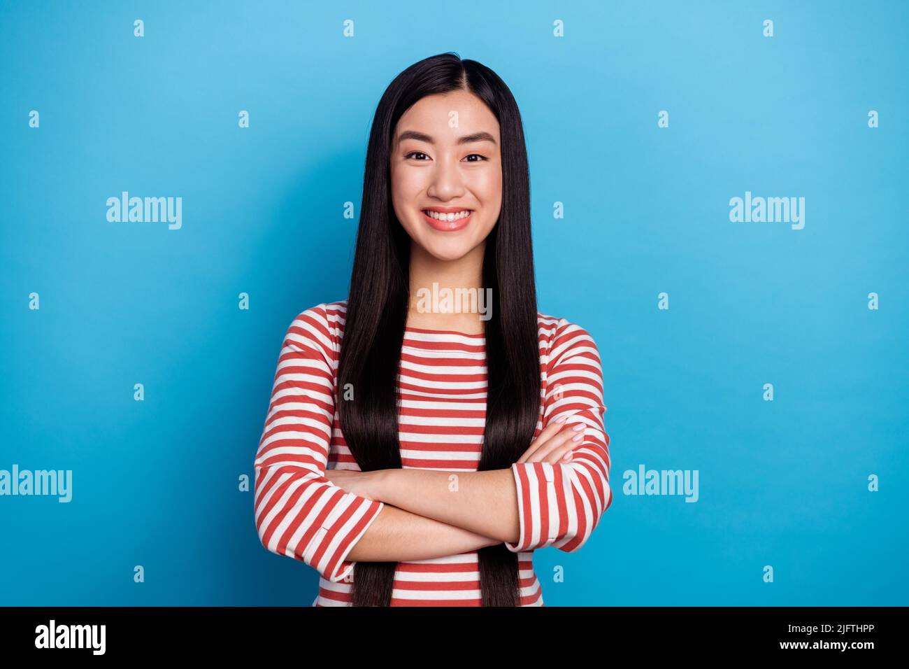 Photo of satisfied gorgeous filipino lady crossed hands toothy beaming ...