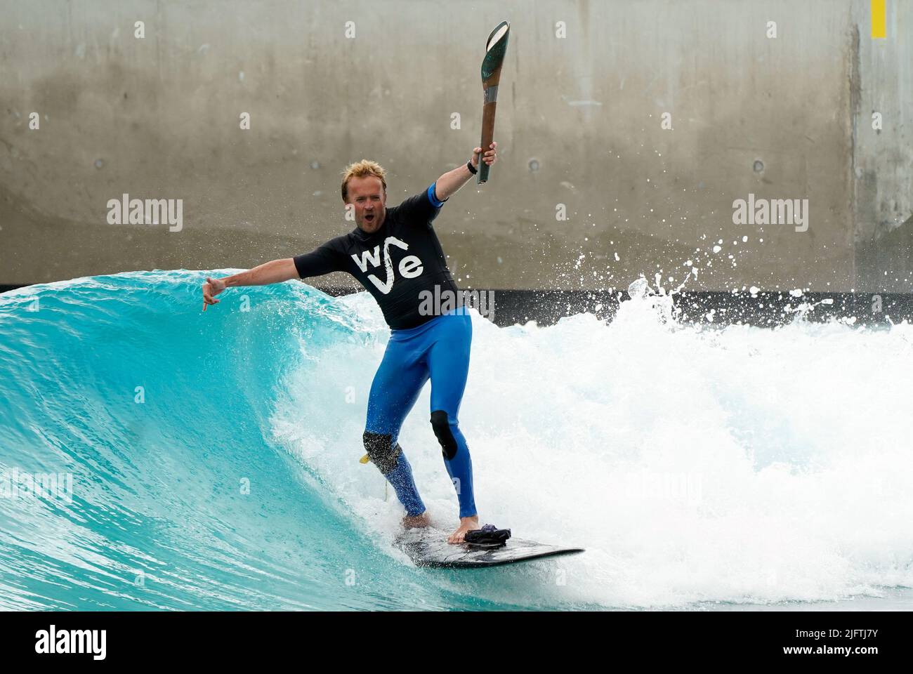 Batonbearer and founder of the Wave, Nick Hounsfield, holds The Queen's ...