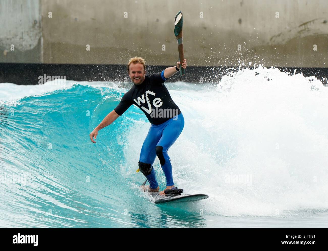 Batonbearer and founder of the Wave, Nick Hounsfield, holds The Queen's ...