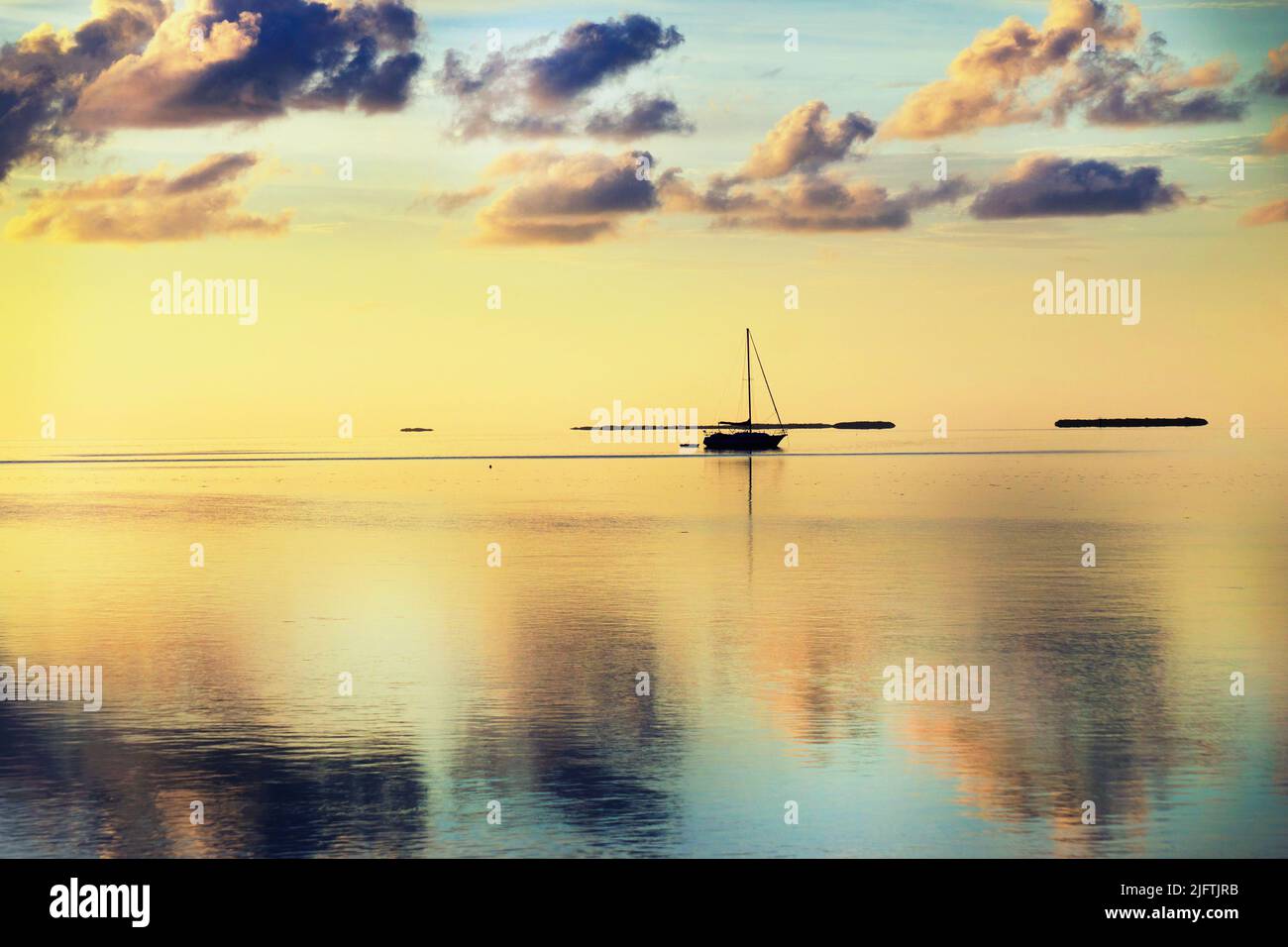 A mesmerizing shot of a boat in a sea under the cloudy sky during the ...