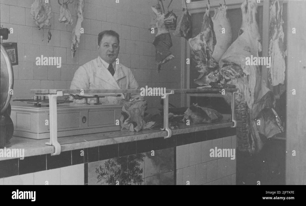 Butcher Louis Jansen in his store on the east side of the Grotestraat ...