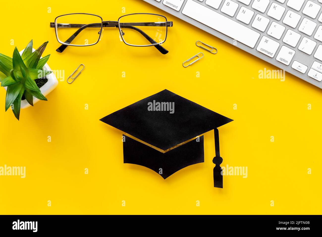 Academic cap or graduation hat on students desk. Education concept ...