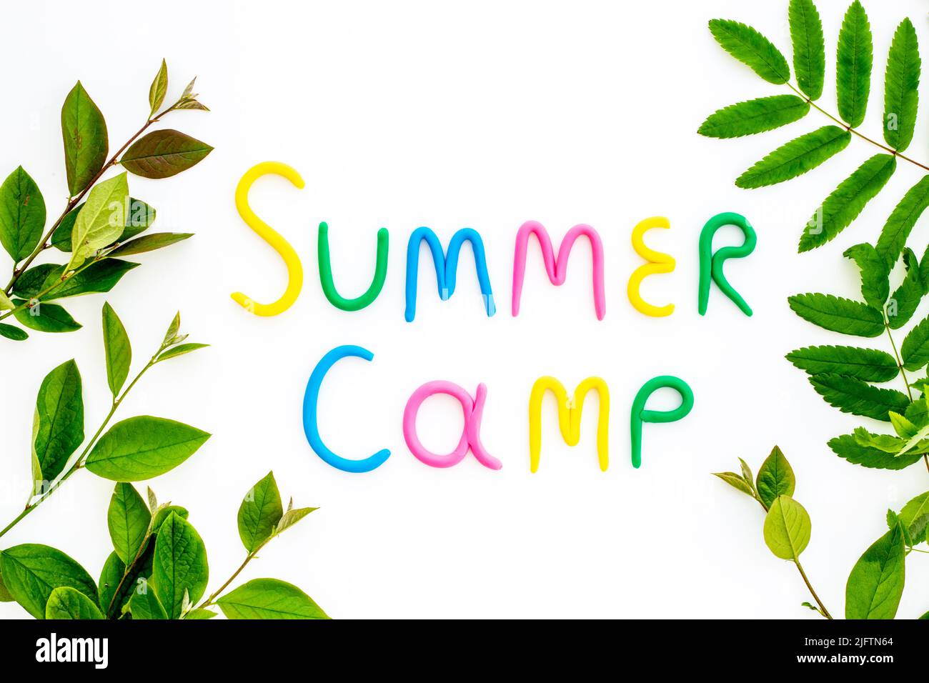 Summer Camp made of clay with green tree branches. Forest kids camp ...