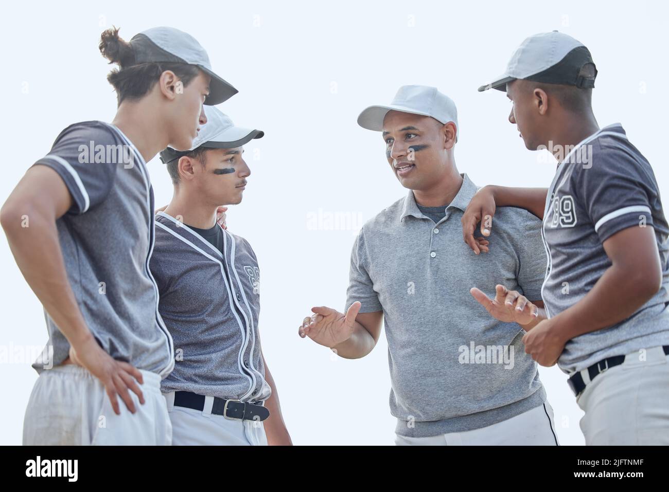 Baseball coach from below giving match pep talk and planning game ...