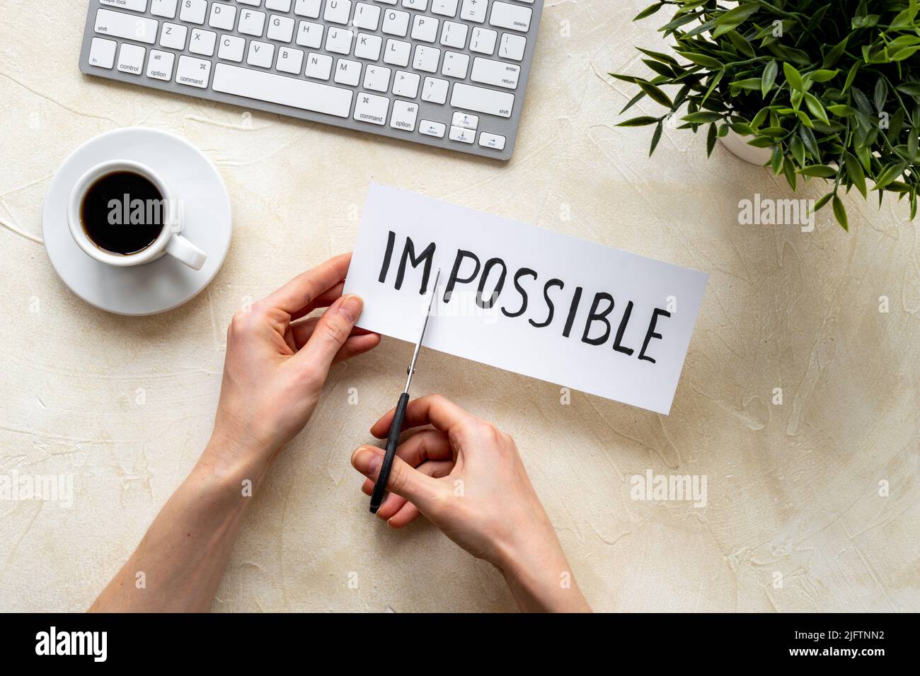 Hands changing word impossible to possible with scissors. Selfmade ...
