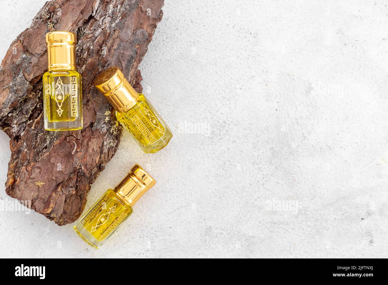Glass bottles of perfume Oud oil. Aromatic Arabian oil Stock Photo - Alamy