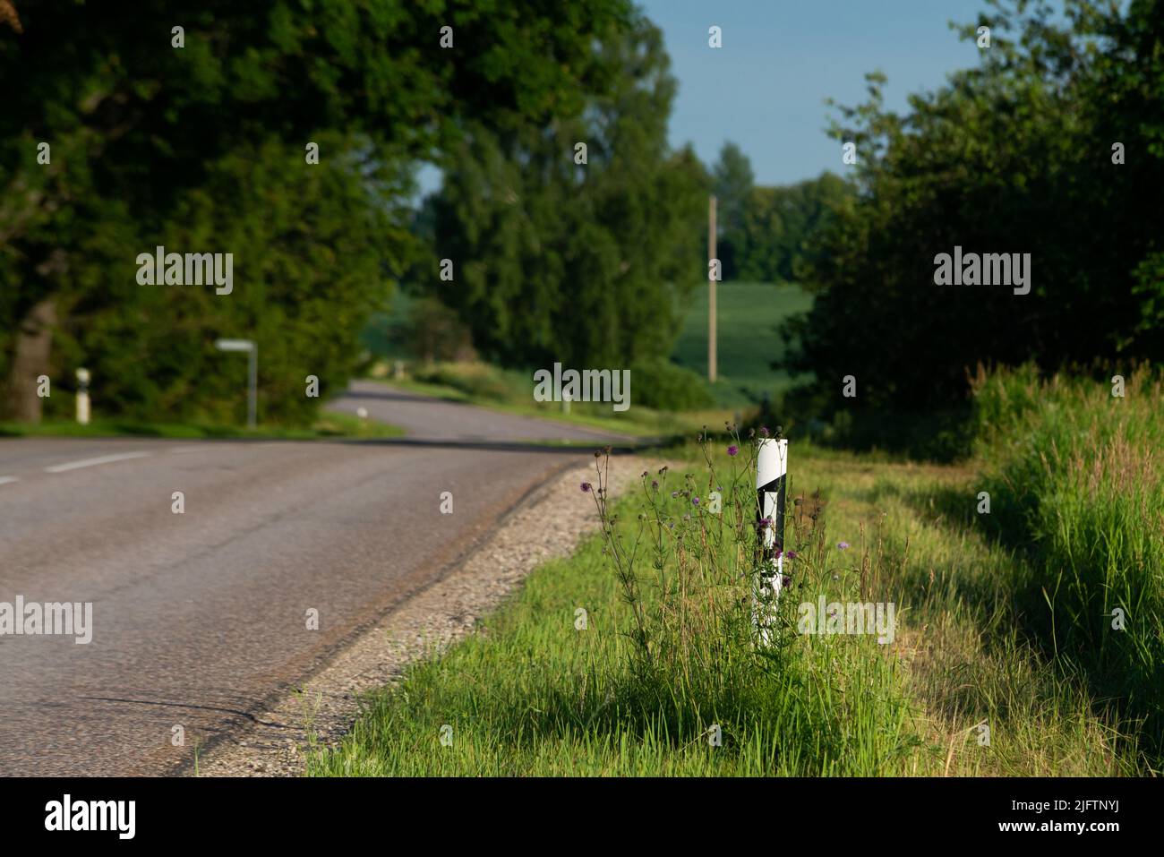 Vehicles passing the 5th (five) kilometer mark indicating the length of ...