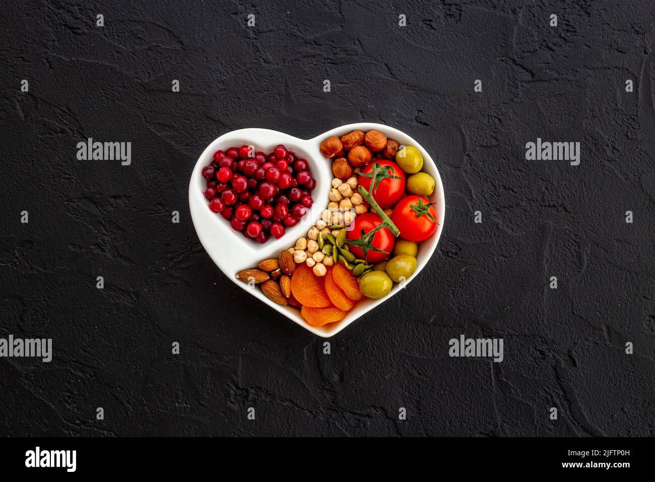 Healthy food in heart shaped dish. Healthy lifestyle and nutrition ...