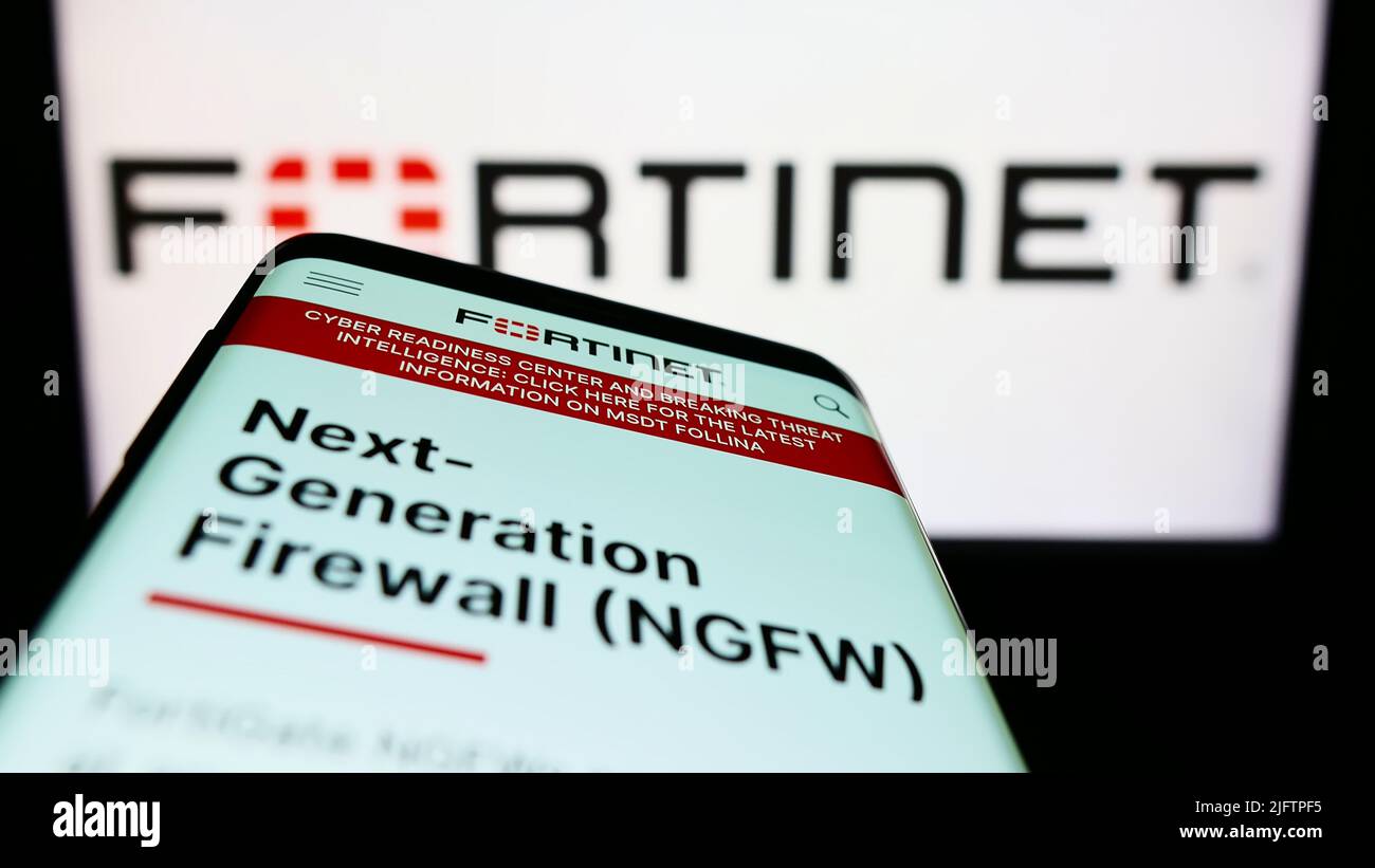 Smartphone with webpage of American cybersecurity company Fortinet Inc ...