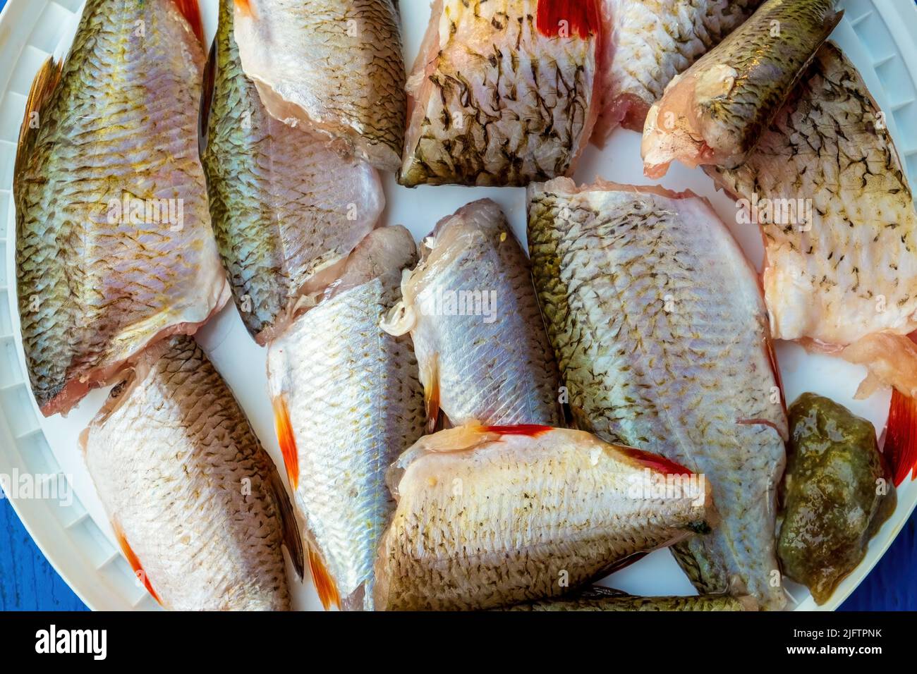 River fish. Cleaned and ready to cook. Roach and redfin Stock Photo - Alamy
