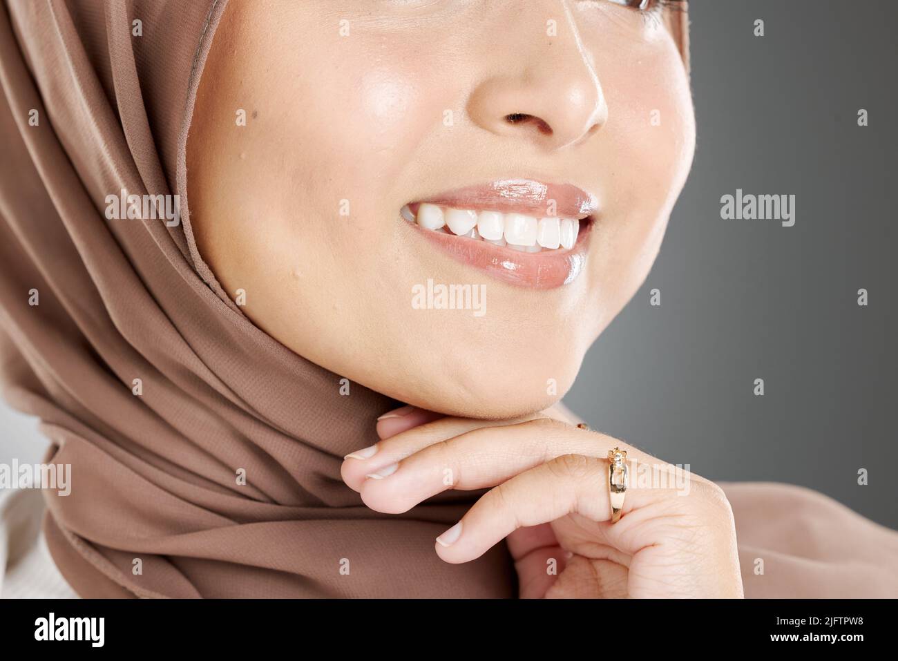 Young woman wearing a hijab or headscarf showing her natural looking ...