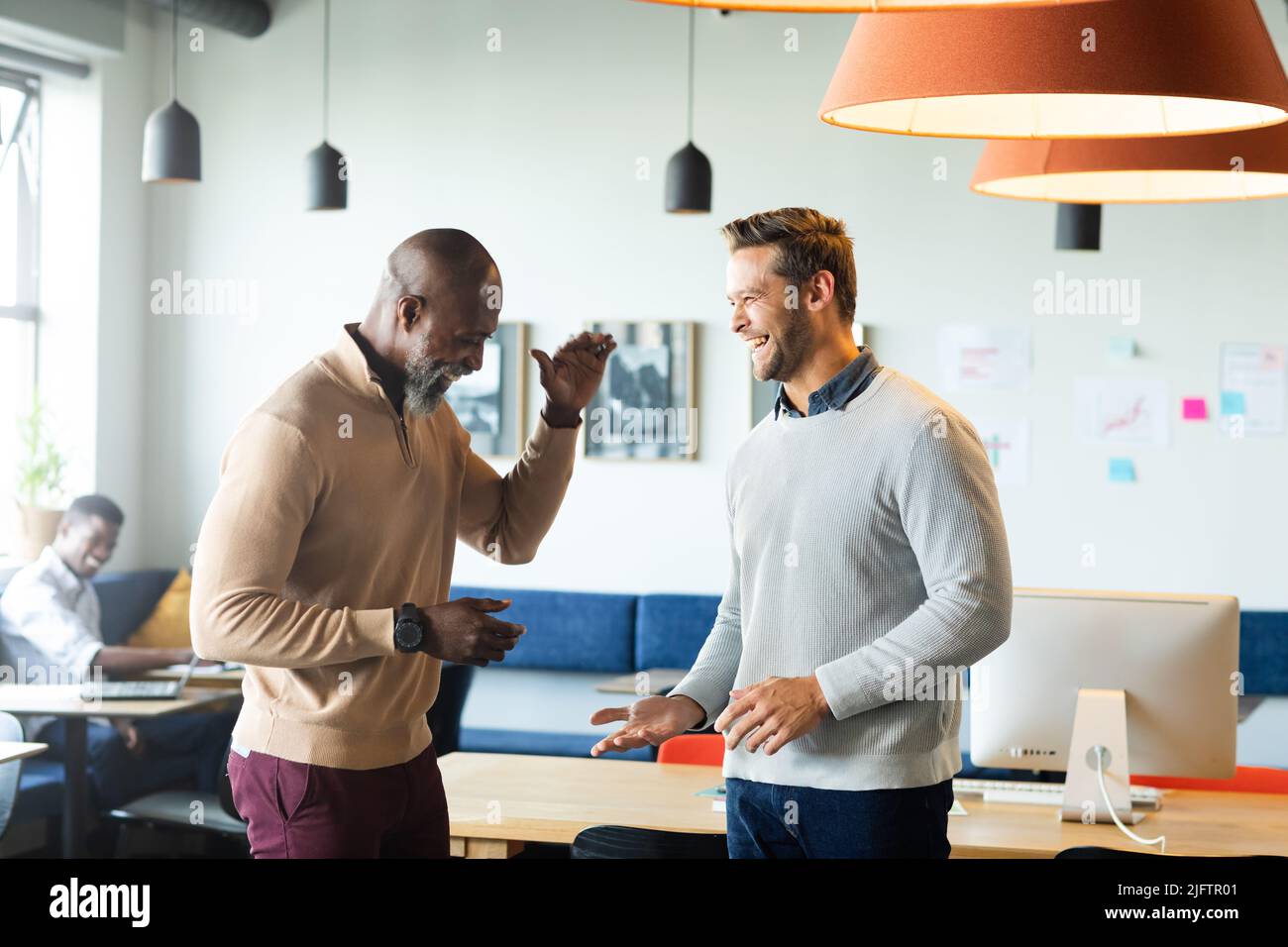 Happy business people high fiving in office hi-res stock photography ...