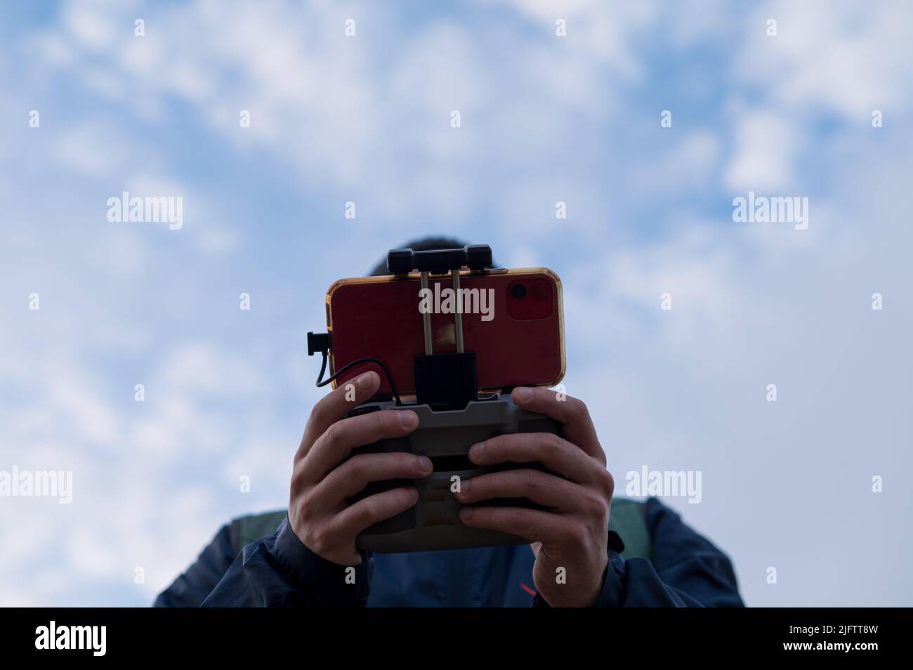 Person using remote control hi-res stock photography and images - Alamy
