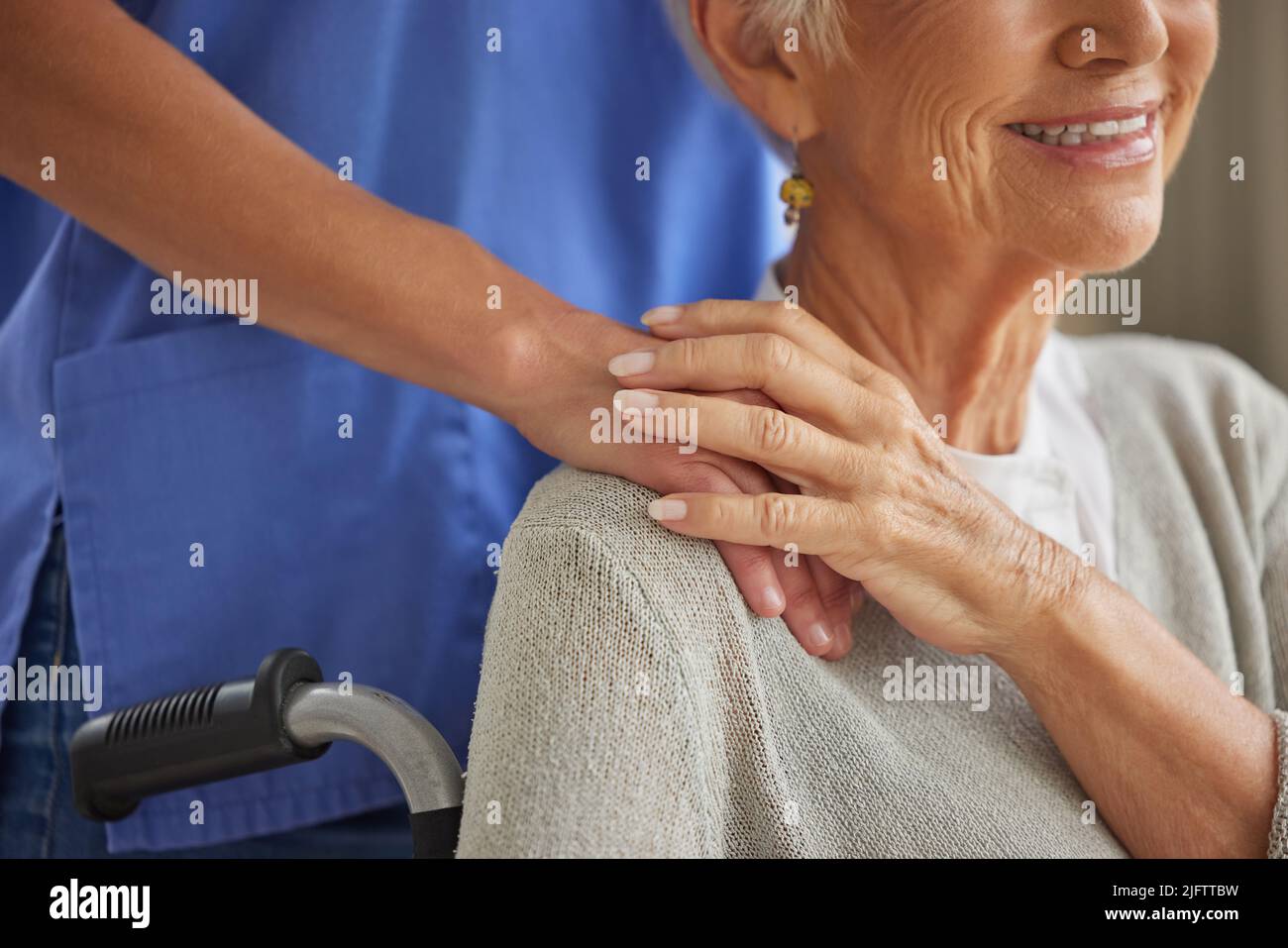 Closeup of a doctor comforting and supporting a patient by holding ...