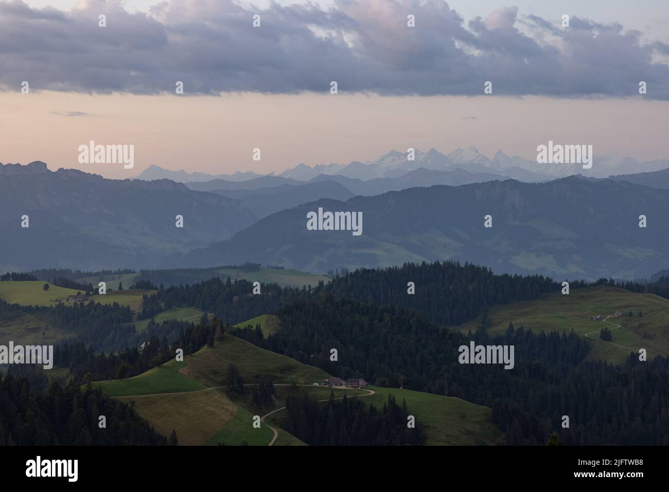 A beautiful shot of a countryside with dense forests and mountains in ...