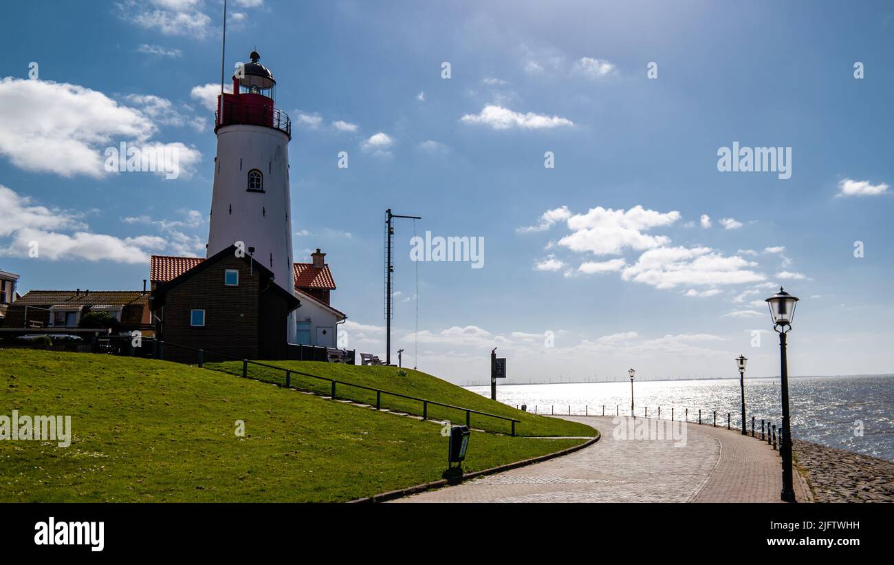 Urk Flevoland Netherlands sunset at the lighthouse and harbor of Urk ...