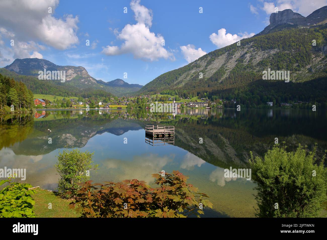 Reflections on the lake Altaussee viewed from the shore, Bad Aussee ...
