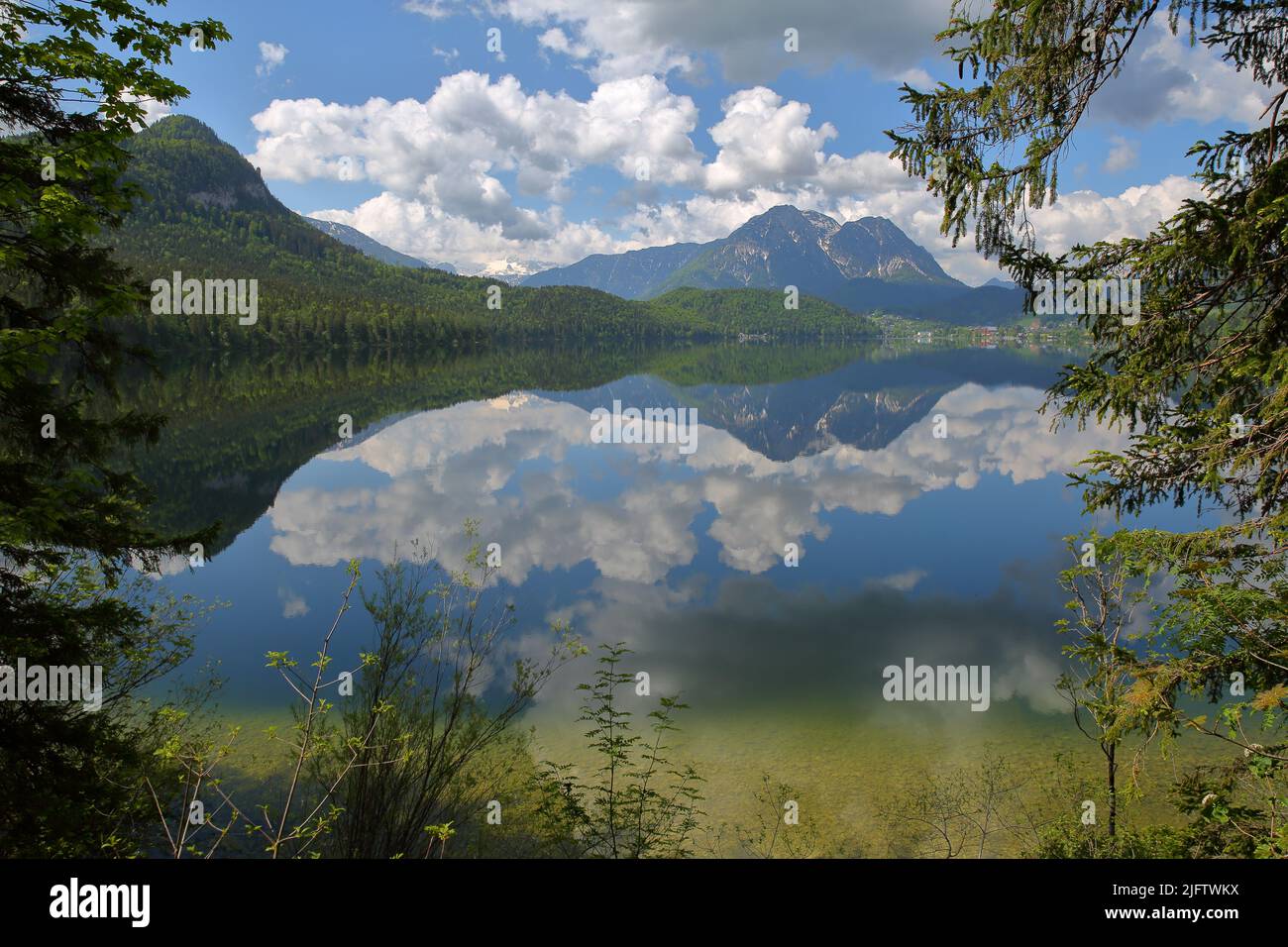 Reflections on the lake Altaussee viewed from the shore, Bad Aussee ...