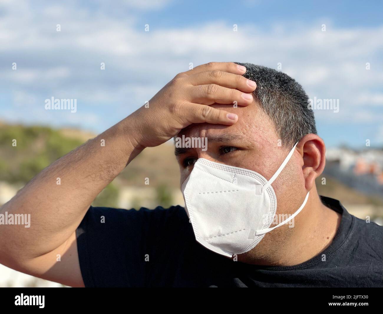 Man wearing a face mask during the COVID-19 pandemic Stock Photo - Alamy