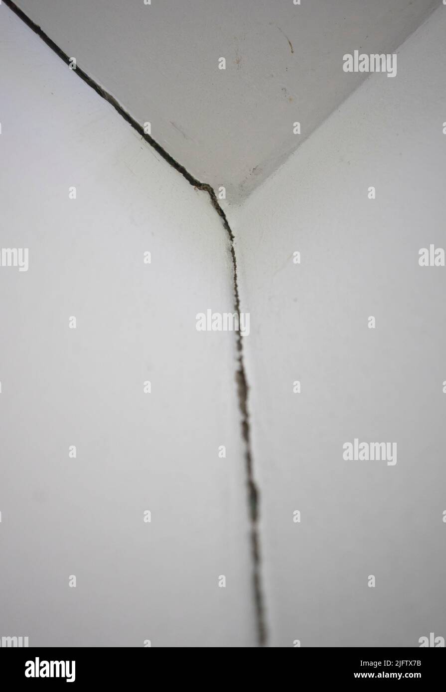 A Crack on the wall corner. The glue on the corner tiles are released ...