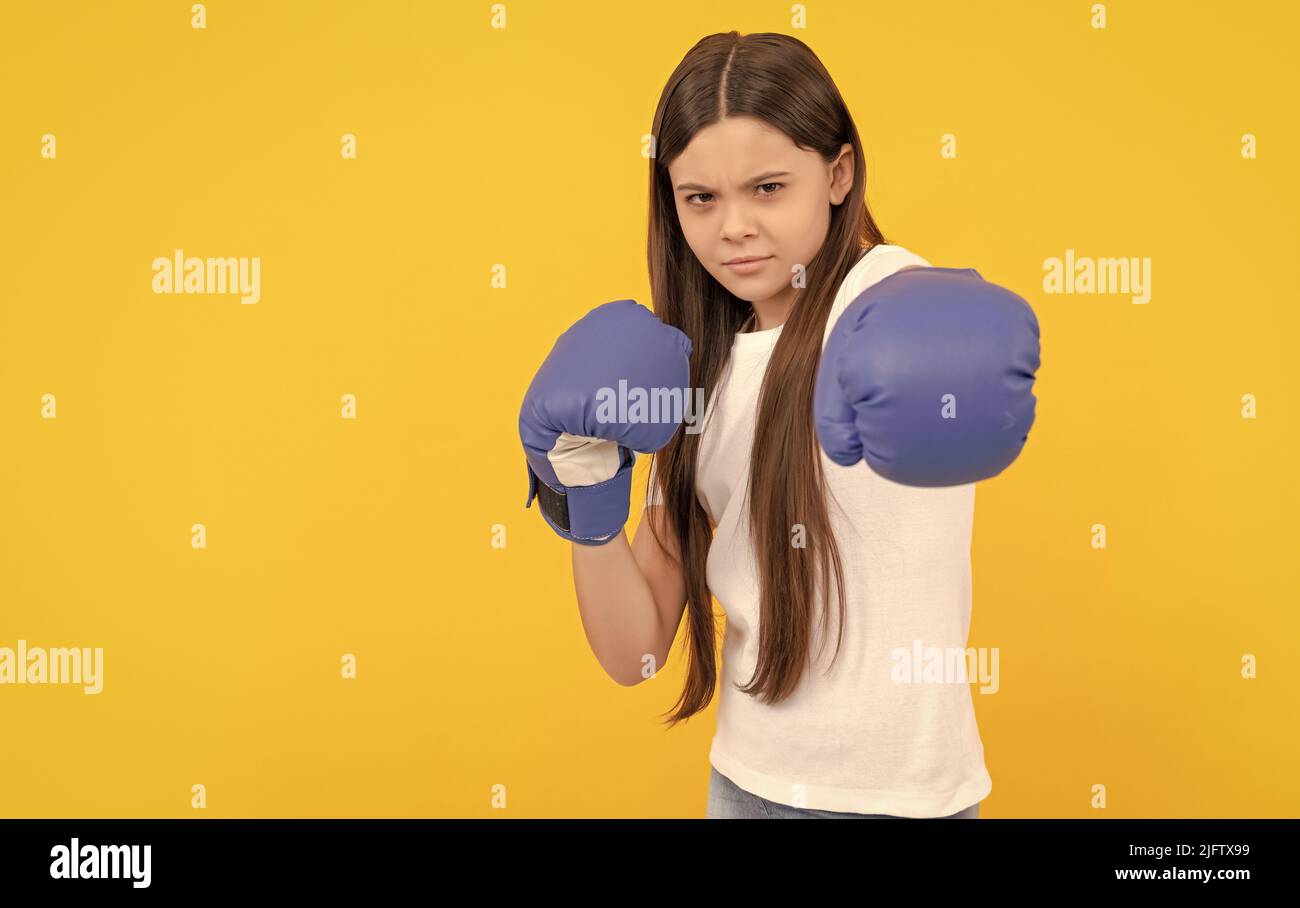 angry child punch in boxing gloves on yellow background Stock Photo - Alamy