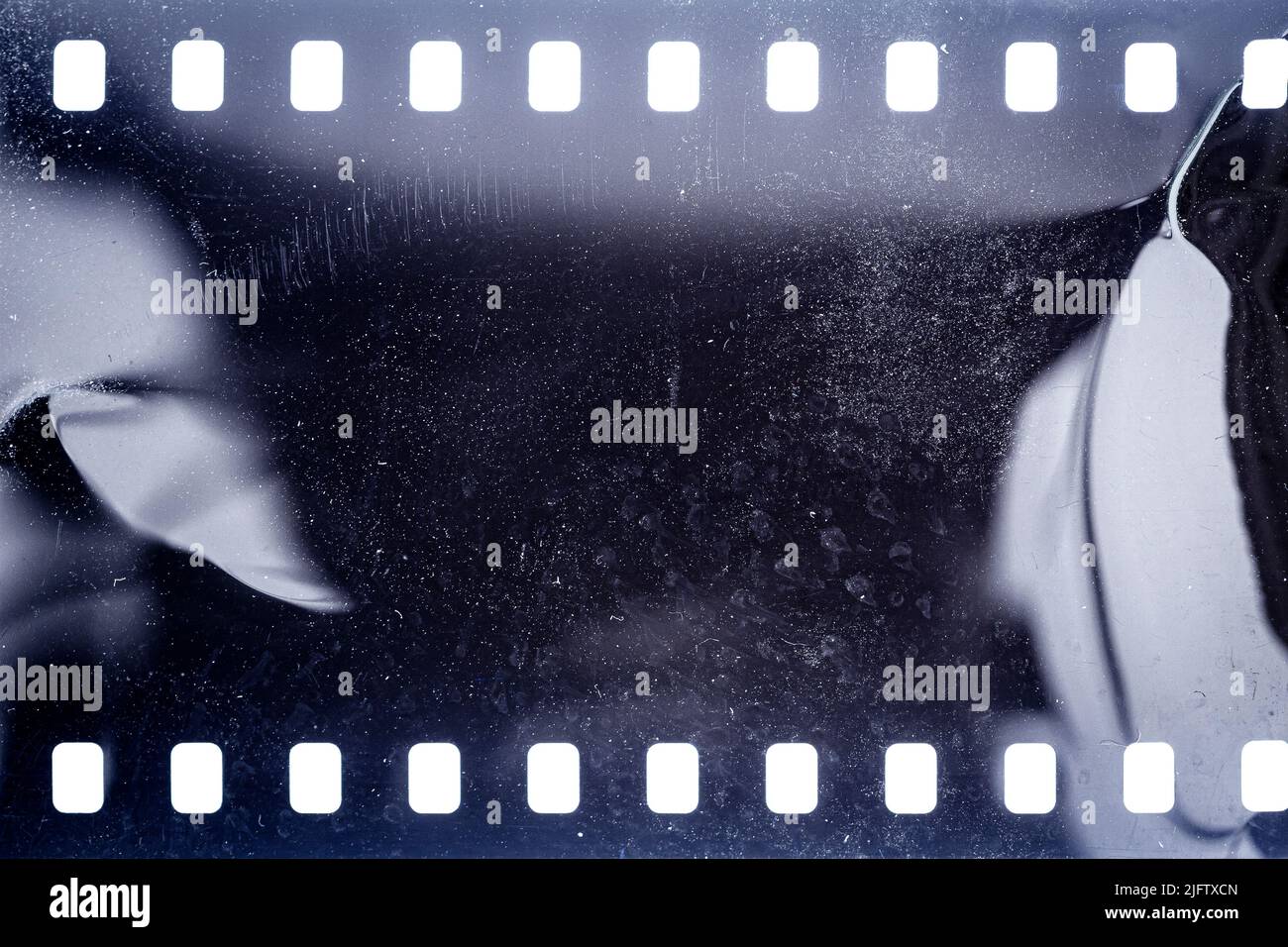 Dusty and grungy 35mm film texture or surface. Perforated scratched ...