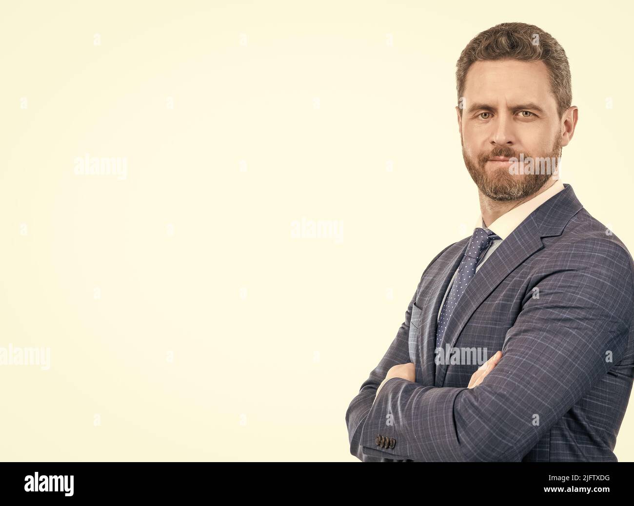 Serious confident man boss in formal suit keep arms crossed isolated on ...