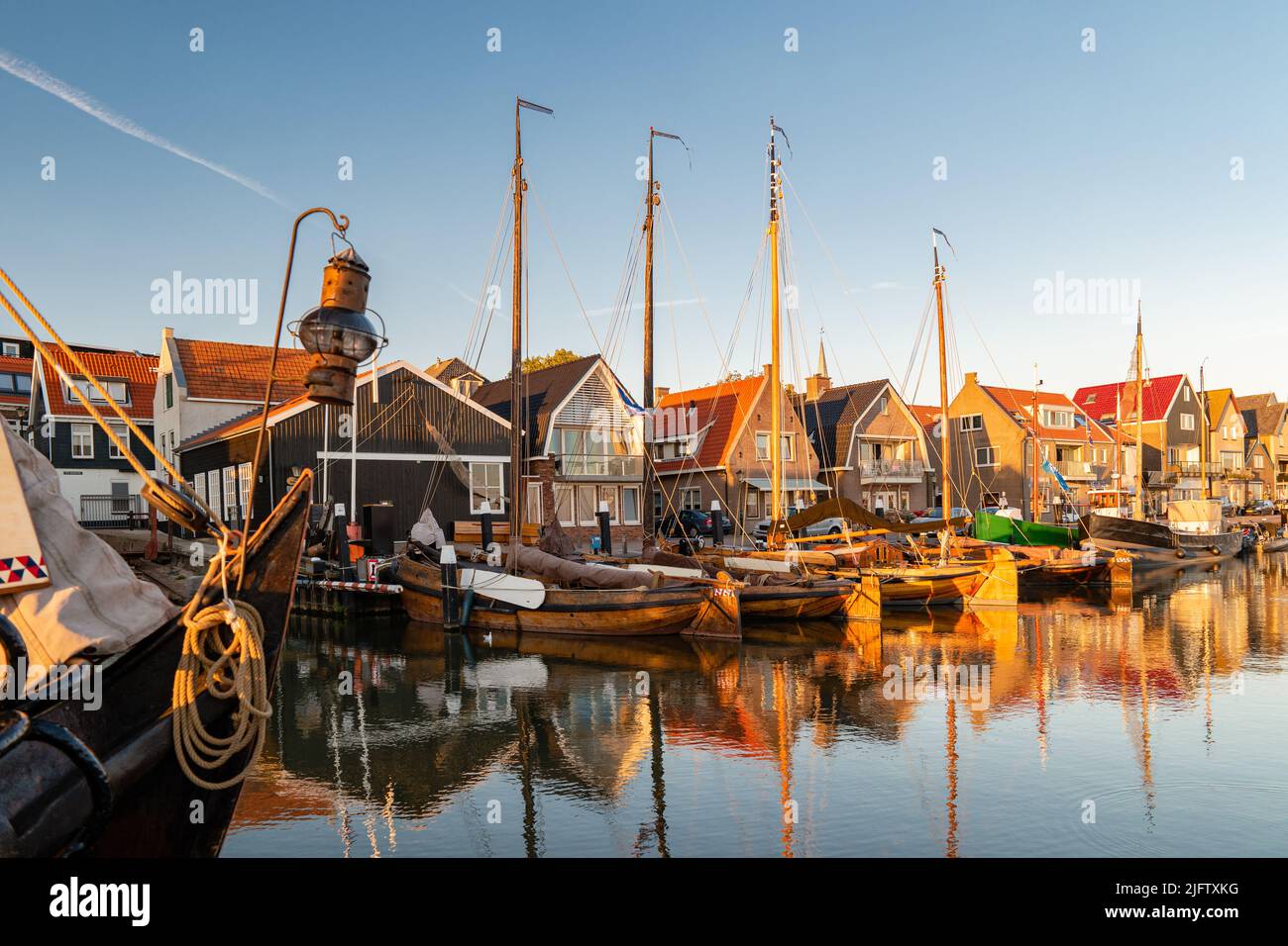 Urk Flevoland Netherlands sunset at the lighthouse and harbor of Urk ...