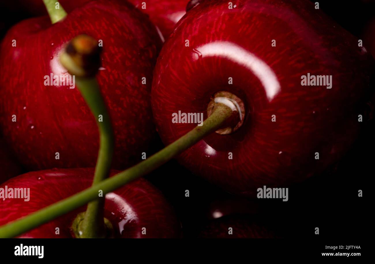 Red juicy sweet cherries. Juicy maroon fruit close-up. Cherries in ...