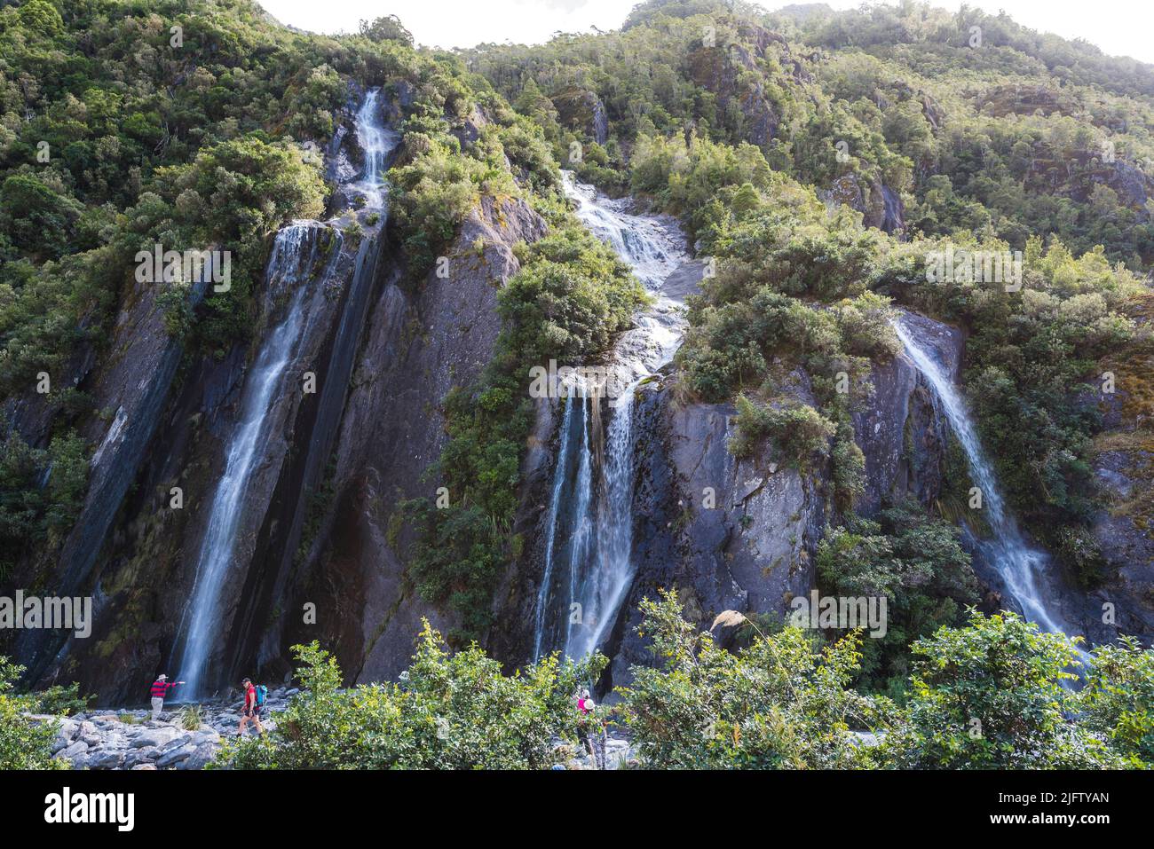 A low-angle shot of waterfalls in Fox Glacier, Westland Tai Poutini ...