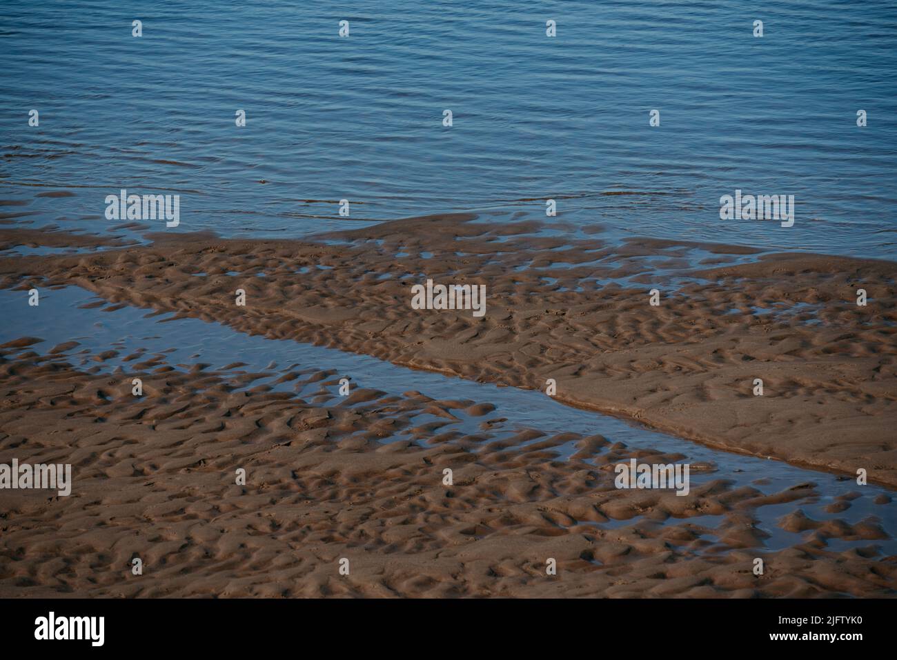 River shallowing. Sandy bottom after the waste of water Stock Photo - Alamy