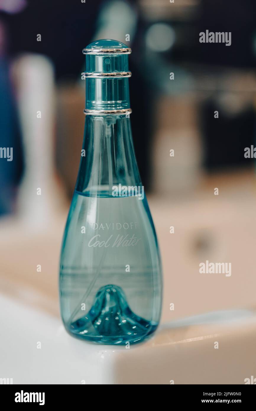 A vertical closeup of Davidoff Cool Water perfume for women in a blue ...