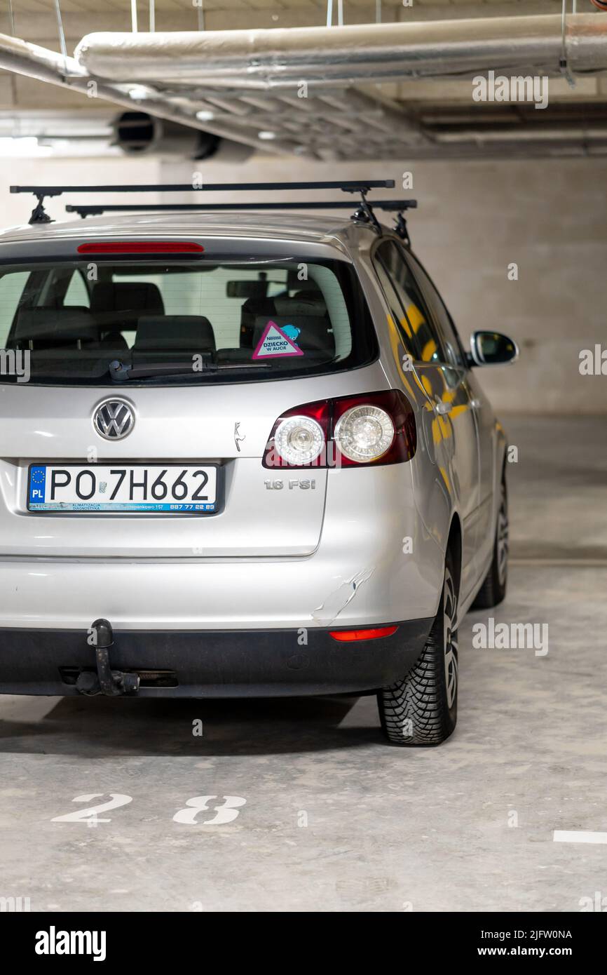 A vertical shot of a parked Volkswagen Golf Plus from behind in a ...