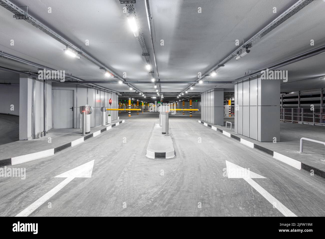 Entrance gate to underground garage parking. Automobile parking inside ...
